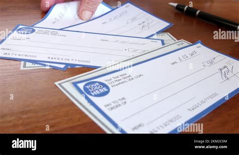 Writing A Cheque For Payment Stock Video Footage Alamy