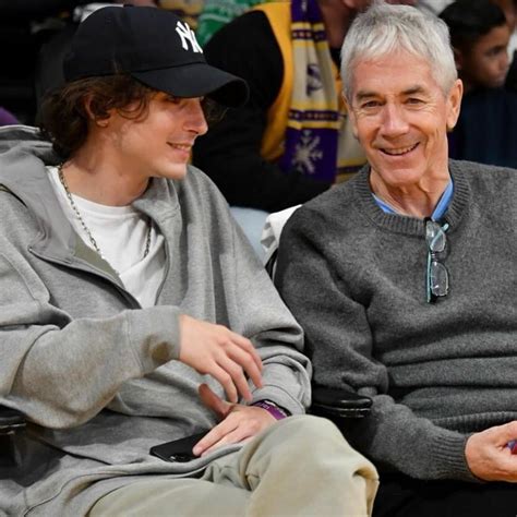 Timothee Chalamet And His Father Marc Chalamet Attend A Basketball Game