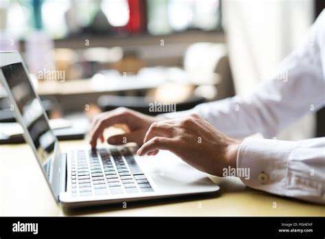 Closeup Of Unrecognizable Businessman Using Laptop Typing On Keyboard