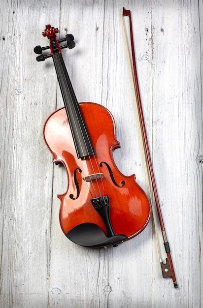 Premium Photo Classic Violin And Bow On White Wooden Background Musical Instrument