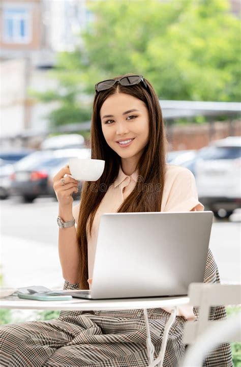 Beautiful Asian Woman Portrait Business Woman With Cup Of Coffee Sitting On Summer Terrace Of