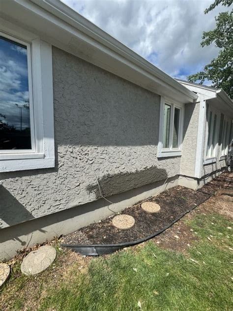 Light Gray Stucco Home Revitalized In Midtown Midtown Stucco Repair Llc