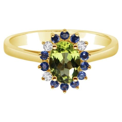 Oval Peridot Green Iolite Blue And Diamonds Cluster Ring In 18 Carat