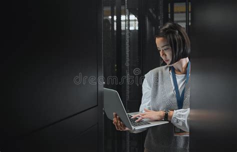 Woman With Laptop Datacenter And Information Technology Engineer And Server Room With Software