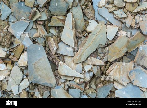 Close Up Of Shattered Slate Type Stone In A Field Concept International Rock Day Broken