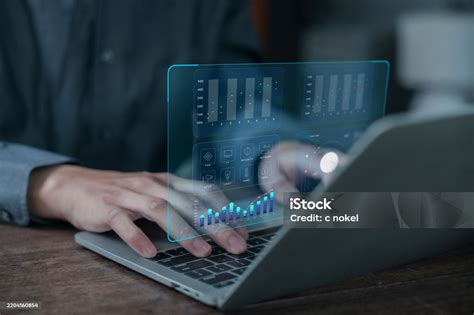 A Man Using Laptop To Analyze Data Shows A Dashboard Chart For Home