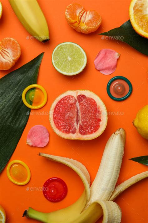 Sex Concept With Fruits And Condoms On Orange Background Stock Photo By AtlasComposer
