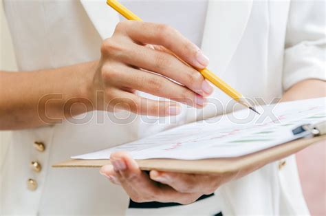 Womans Hands Holding A Binder While Stock Image Colourbox