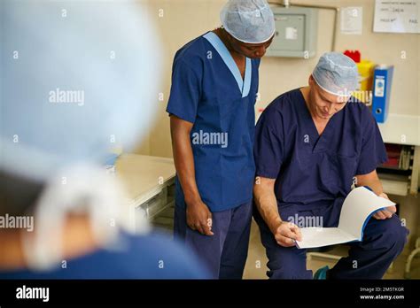 Double Checking The Patients Stats Before The Operation Surgeons Going