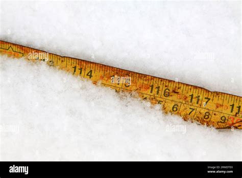 Yellow Steel Tape In The Snow Abandoned Object Stock Photo Alamy