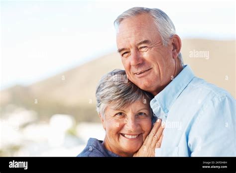 Cute Mature Couple Portrait Of Smiling Mature Woman Leaning On Mans