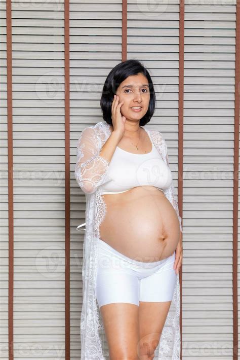 Portrait Of A Pregnant Woman Touching Her Big Belly Close Up Mother