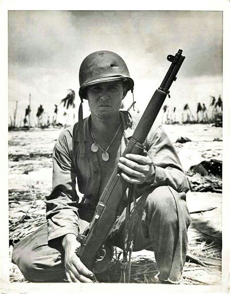 Marine With A Hole In His Helmet Poses With His M1 Garand On Tarawa