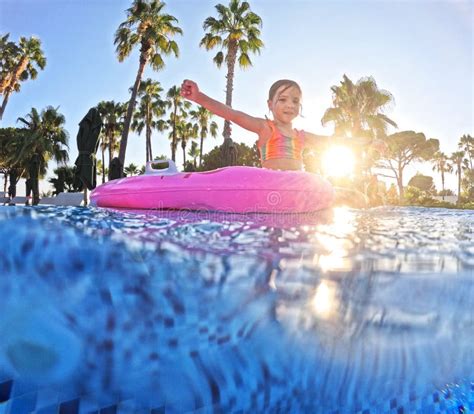 Girl Floats On Pink Inflatable In The Pool Beach Resort Vacation By