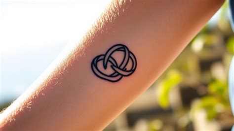 Qos Tattoo Meaning And Symbolism
