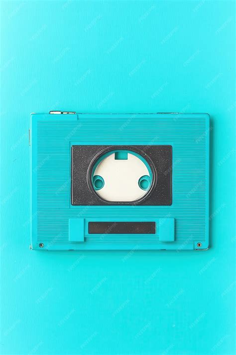 Blue Cassette Tape On Turquoise Background Premium Ai Generated Image