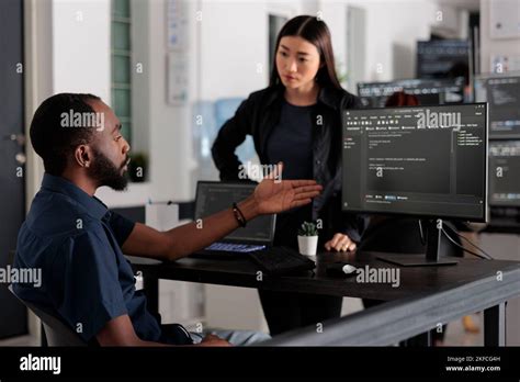 Diverse Team Of Software Developer Developing Html Code And Cloud Computing In It Development