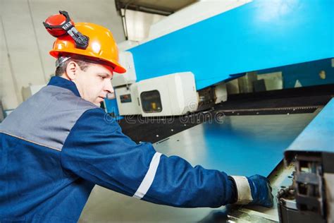 Cnc Operator At Metal Machining Milling Center In Tool Workshop Inserting Data With Keyboard
