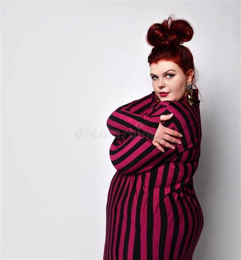 Plus Size Redhead Model In Striped Dress Earrings She Is Hugging