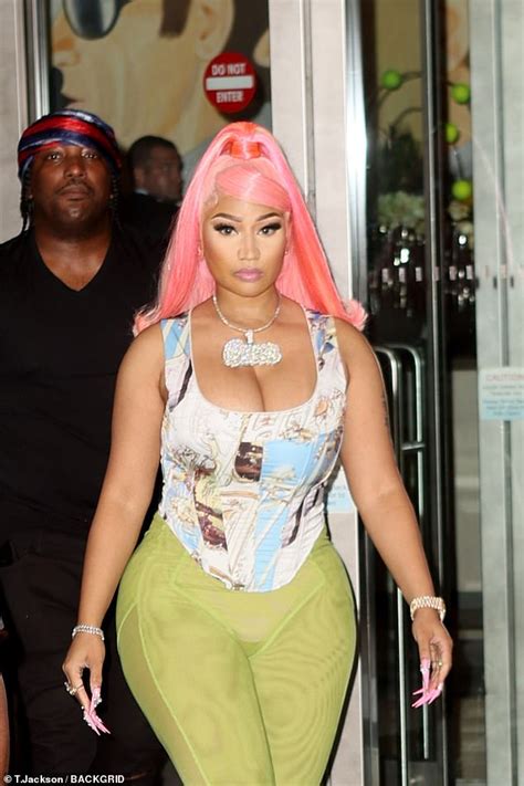Nicki Minaj Opts For A Bright Look With Pink Hair And Green Pants As