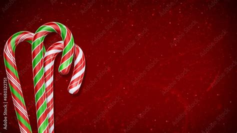 Candy Cane Dance With Snow On Red Background 4k Loop Features Candy Canes Dancing In Front Of A