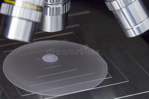 Close Up Of Examining A Sample Of Sapphire Wafer Under The Microscope In Laboratory A