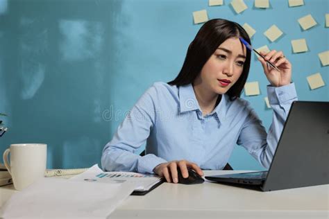 Pensive Asian Entrepreneur Thinking About Work Strategy Stock Image
