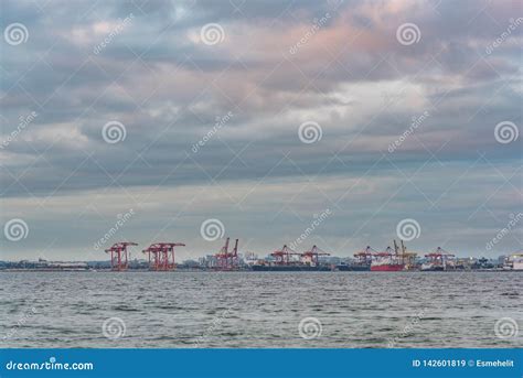 Seaport With Cranes And Cargo Ships On Sunset Stock Image Image Of Crane Seaport 142601819