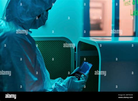 Experienced Labratory Scientist Examining Dna Experiement Testing Equipment In The Labratory