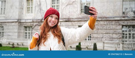 Cute Ginger Girl In Red Hat Takes Selfie During Her Tourist Trip Abroad