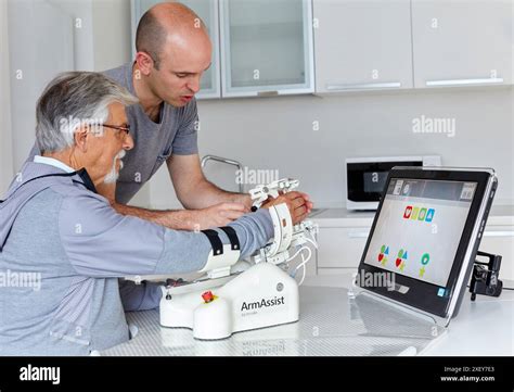 patient with assistive robot for upper limb rehabilitation the robot