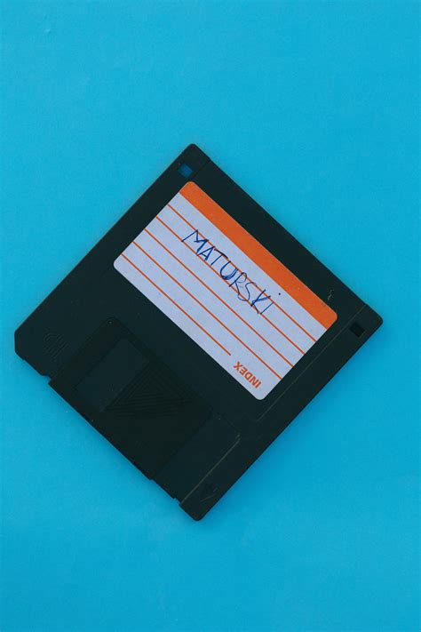 free picture old fashioned data storage floppy disk on blue background
