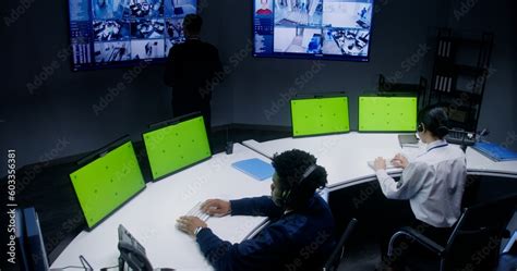 Multiracial Officers Control Security Cameras Workers In Monitoring Control Center Big Digital