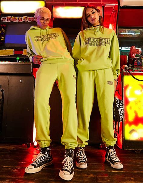 Reclaimed Vintage X Stranger Things Unisex Sweatpants In Washed Yellow