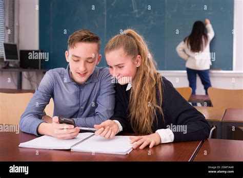 Female And Male Babes Writing Notes Together Stock Photo Alamy