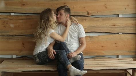 Young Couple On The Background Of Wooden Wall Hugging Stock Footage Video Of Clothing