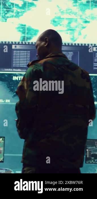 Vertical Video General Of The Army Overseeing Special Reconnaissance Mission In Control Center
