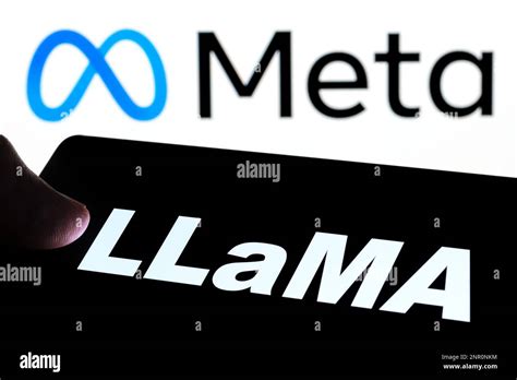 LLaMA Letters Seen On Smartphone And Blurred Meta Company Logo On