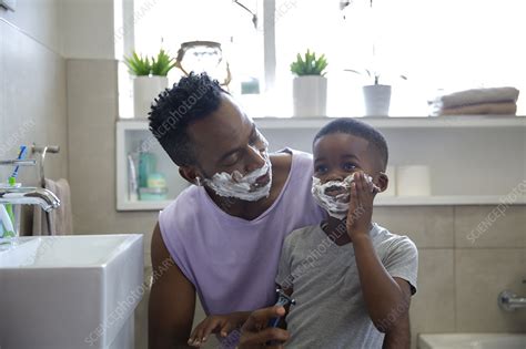 Father And Son Playing With Shaving Cream In The Bathroom Stock Image F Science