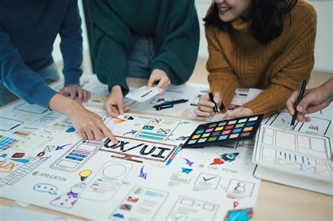 Premium Photo Asian Team Ux Developer And Ui Designer Brainstorming