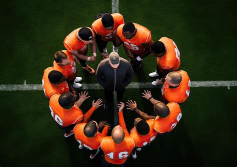 Premium Ai Image An Aerial Shot Of A Coach Leading A Team Huddle On A Football Field The Image