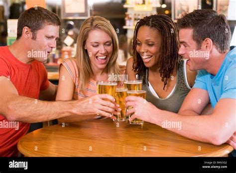 Two Couples Having Beer Together Stock Photo Alamy