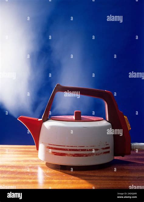 Boiling Kettle Steam Rises From An Electric Kettle As It Boils Water