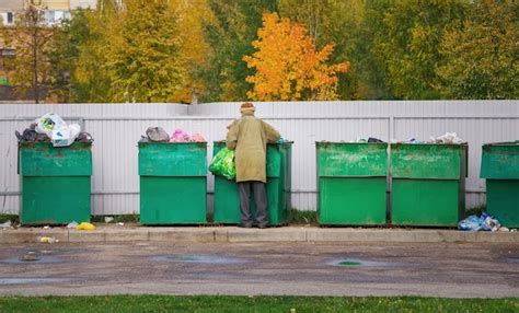 Premium Photo Poor Homeless Old Man Searching In Garbage In Autumn
