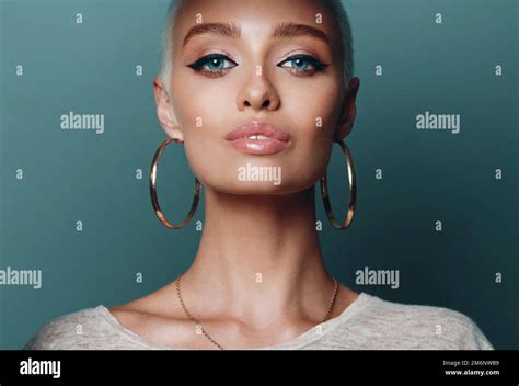 Portrait Of Face Young Beautiful Woman With Large Round Gold Earring