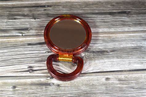 hand mirror mirror glass a mirror is an object that reflects an image also called a looking