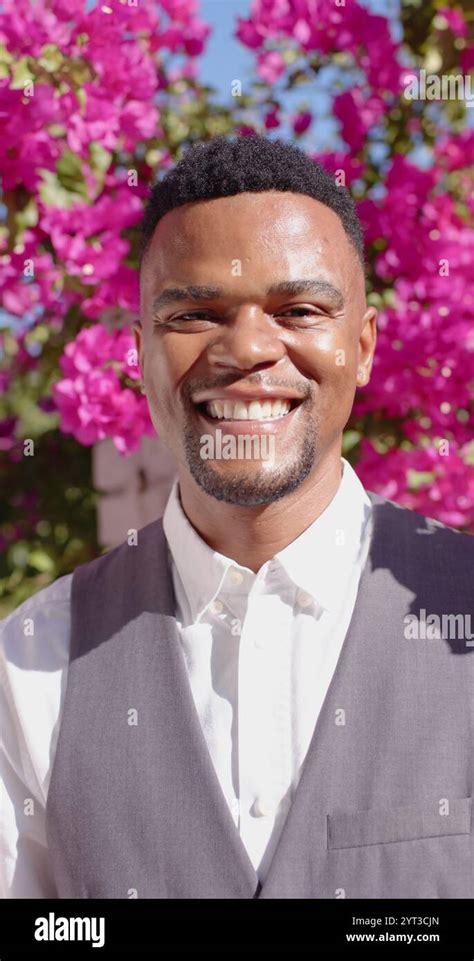 Vertical Image Of Portrait Of Happy African American Man Looking At