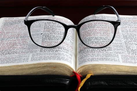Glasses In Black Frame On Open Bible Free Image Download