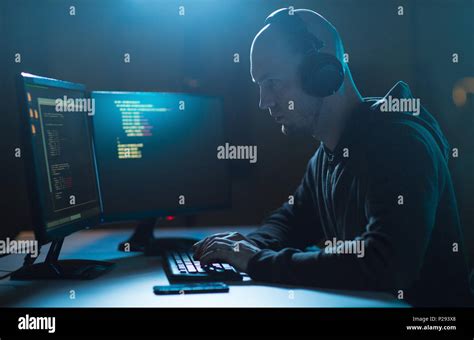 Hacker With Coding On Laptop Computer In Dark Room Stock Photo Alamy