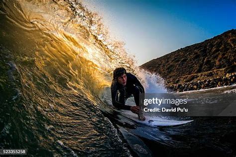 Surfer Inside Wave Photos And Premium High Res Pictures Getty Images